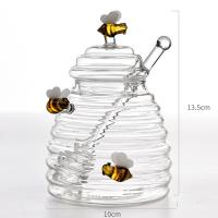 China 450ml Transparent Food Grade Glass Honey Pot with Stirring Rod and Bees Storage Jar for sale