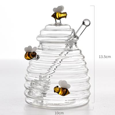 China 450ml Transparent Food Grade Glass Honey Pot with Stirring Rod and Bees Storage Jar for sale