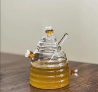 China 450ml Transparent Food Grade Glass Honey Pot with Stirring Rod and Bees Storage Jar for sale