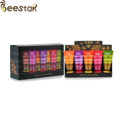 China Squeezable Tube Flavored Honey 120g per Tube Natural Honey Blend Fruit Honey Multiflora Honey Bulk Supply for sale