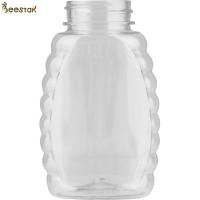 China Wholesale Factory Price 375ml Special Plastic Honey Jar And Spoon Plastic Bottles For Honey for sale