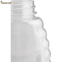 China Wholesale Factory Price 375ml Special Plastic Honey Jar And Spoon Plastic Bottles For Honey for sale