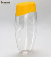 China Food Grade Plastic Factory Price Special Plastic Honey Jar And Spoon 335ml Empty for sale