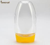 China Food Grade Plastic Factory Price Special Plastic Honey Jar And Spoon 335ml Empty for sale