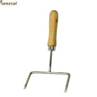 China Beekeeping Equipment Stainless Steel Foundation Sheet Fork With Wooden Handle for sale