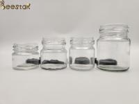 China 50ml 75ml Bird Nest Bottle Round Glass Honey Pot Glass Container Bottles With Black Lid for sale