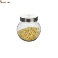 China 50ml Honey Jar And Spoon Flat Bottle With Metal Lid for sale