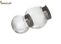 China 50ml Honey Jar And Spoon Flat Bottle With Metal Lid for sale