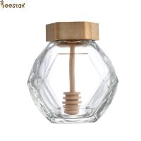 China 380ML Glass Honey Hexagon Jar With Wooden Cover And Wooden Splash Bar for sale