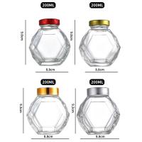 China 200ML 380ML Glass Hexagon Honey Bottle With Golden Silver Red Black Metal Lid for sale