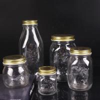 China Carved Flower Honey Glass Jar And Spoon Transparent Honey Container for sale