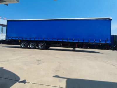 China Steel Tri Axle Side Curtain Semi Trailers With Jost E100 Landing Gear And Competitive for sale