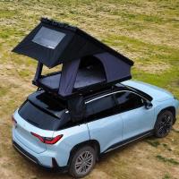 China Outdoor self driving camping roof tent with large black glue aluminum shell triangular roof tent inside for sale