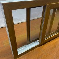 China PVC Vertical Sliding Windows with Double Glazed Glass - Stain Resistant Black Frame 60-120cm Width Range for sale