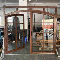 China Arched Aluminum Hinged Doors with 2.0mm Profile Thickness and 5mm+12A+5mm Double Tempered Glass - French Design Wood Color for sale