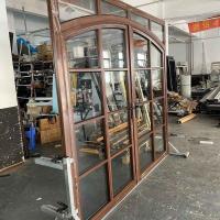 China Arched Aluminum Hinged Doors with 2.0mm Profile Thickness and 5mm+12A+5mm Double Tempered Glass - French Design Wood Color for sale