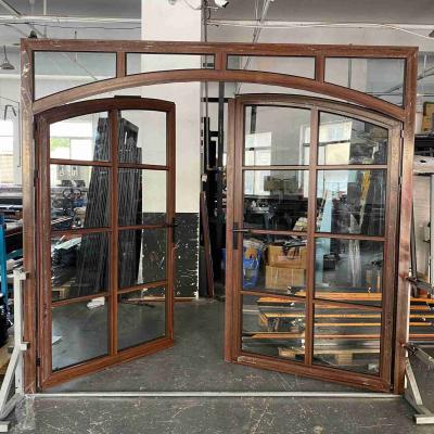 China Arched Aluminum Hinged Doors with 2.0mm Profile Thickness and 5mm+12A+5mm Double Tempered Glass - French Design Wood Color for sale