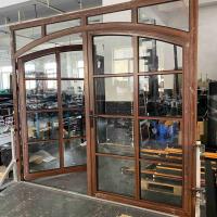 China Arched Aluminum Hinged Doors with 2.0mm Profile Thickness and 5mm+12A+5mm Double Tempered Glass - French Design Wood Color for sale