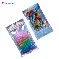 China Mylar Phone Case Holographic Zipper Bag PVC Holographic Printed Plastic Packaging Bags for sale
