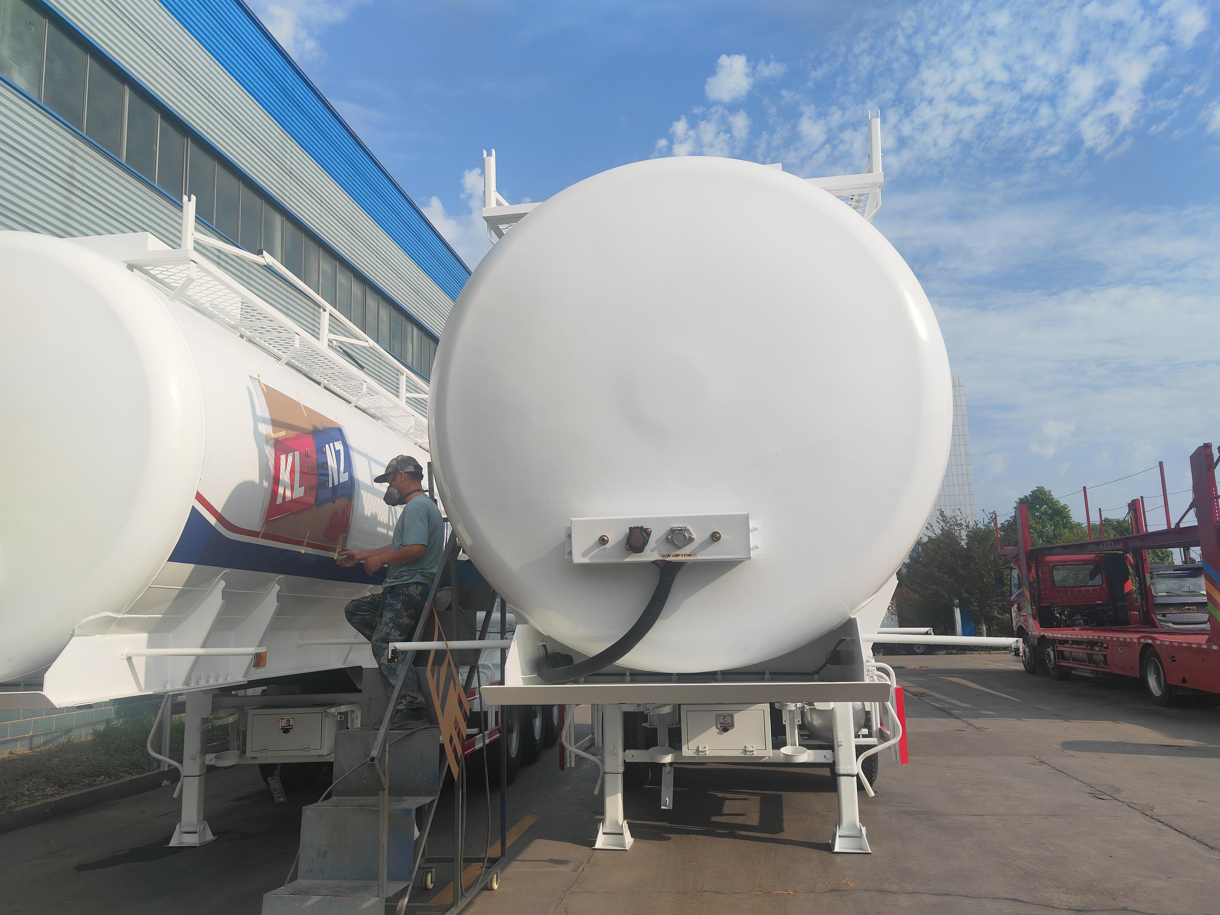 Rear circular tank head configuration of 3 axle chemical trailer with integrated discharge pipe storage and high-visibility LED tail light bumper for Middle East delivery