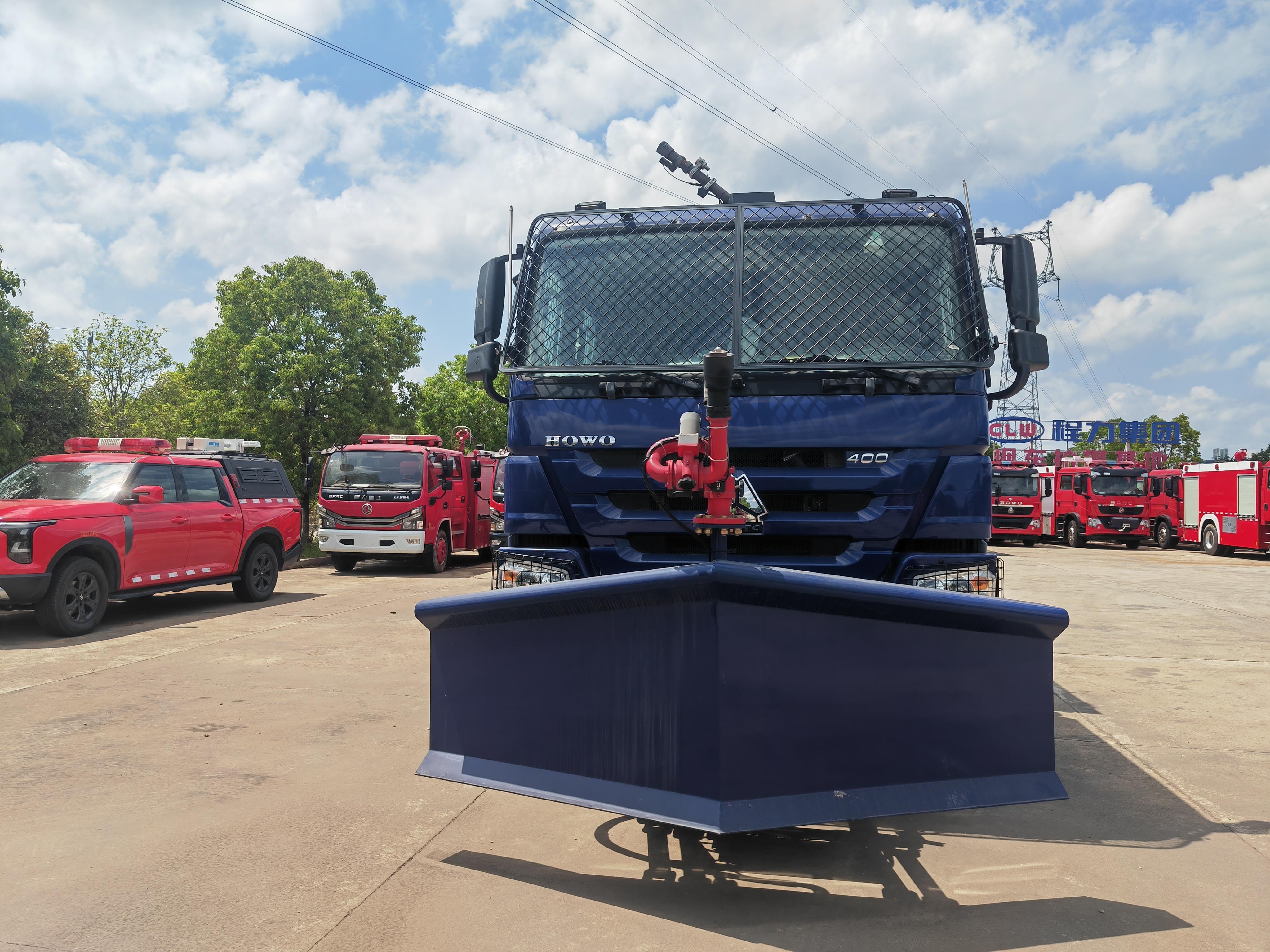 Front view of CLW SINOTRUK HOWO 6x4 anti riot water cannon truck with hydraulic clearing plow and window mesh guards