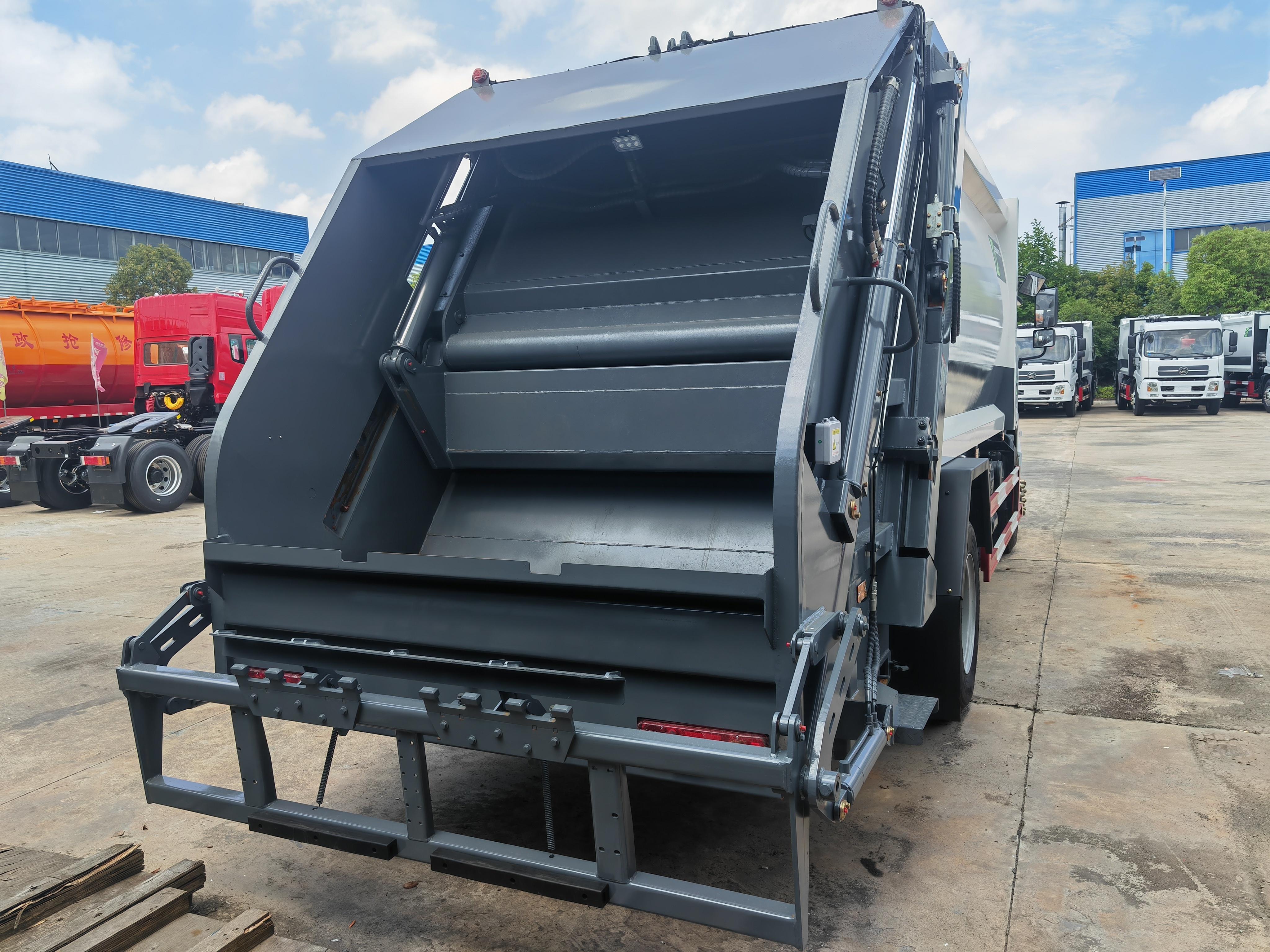 American style dumpster tipper and bin lifter mechanism on CLW rear loader garbage truck