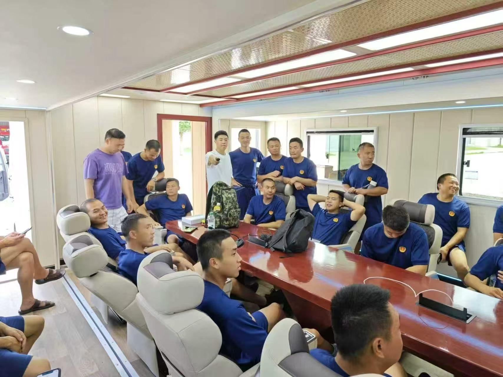 he fully expanded Mobile Command Center Interior during live video conference training.
