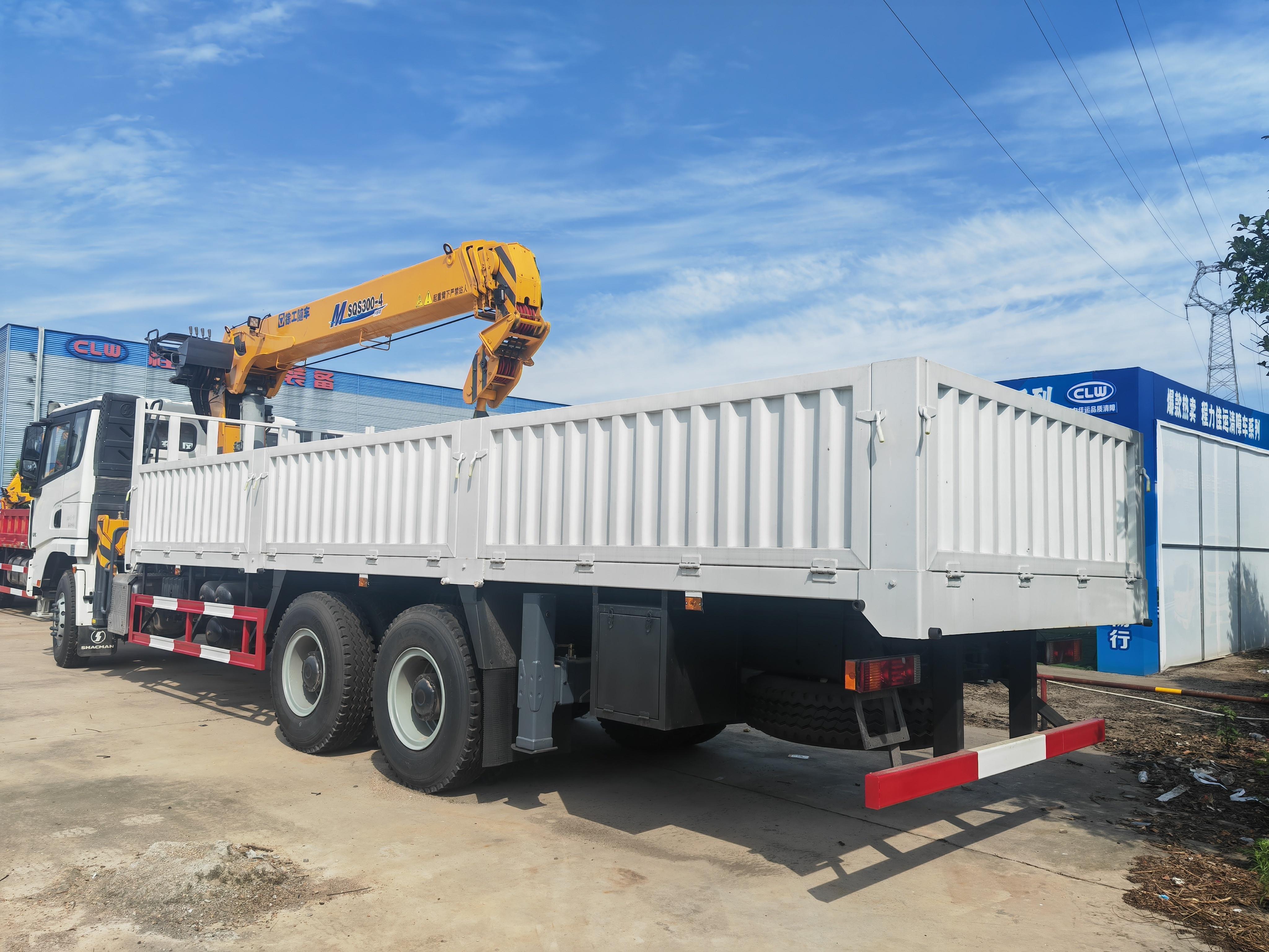 Shacman X3000 6x4 lorry crane truck rear side view with XCMG MSQS300-4 crane