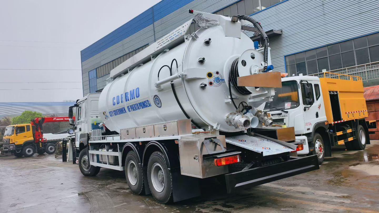 Rear view of HOWO vacuum sewage suction truck showing discharge door and high pressure jetting system