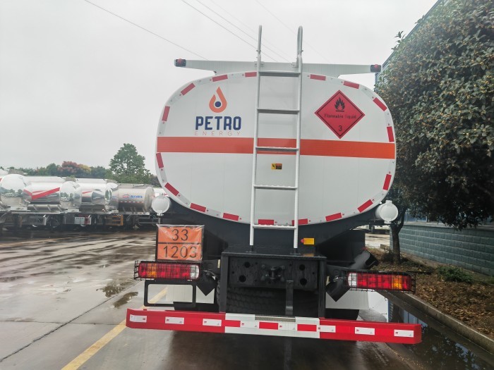 Rear view of HOWO 20cbm fuel tanker showing ladder, tail lights, and UN 1203 hazard warning plate