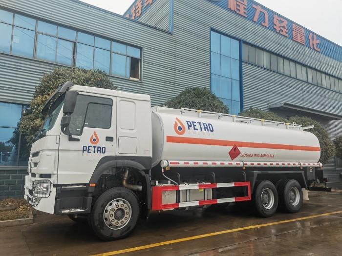 Left side view of HOWO 3 axle 20000 liters oil petroleum tanker truck with side guardrails