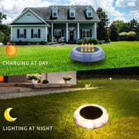 China Solar Disk Light 4pack with IP68 Waterproof, 6-8 Hours Working Time, and Warm White Light for Outdoor Spaces for sale