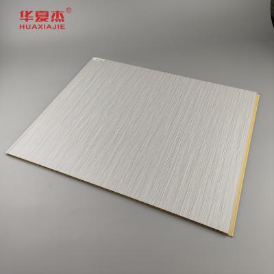 China Indoor Wall Decoration Livingroom Wpc Wall Panel In 600x9mm Laminated Wood Grain for sale