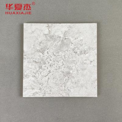 China High-Gloss Lightweight WPC Wall Panel with Easy to Clean White Marble Finish for sale