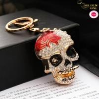 China New Manufacturers European American diamond Ghost head creative epoxy metal 3d hip hop car keychain for bag pendant for sale