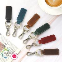China Custom Embossed Logo PU Leather Keychain Metal Strap Blank Solid Color Keyring for sale