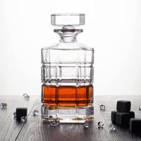 China Round Glass Stopper Bourbon Whiskey Bottle for Cosmetics Engraved Design 30oz Capacity for sale
