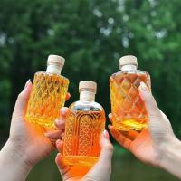 China Glass Bottle With Cork For Vodka Whiskey Liquor Industrial Cosmestic Round Shape for sale