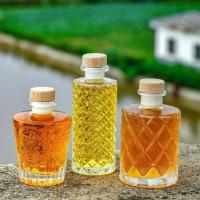 China Glass Bottle With Cork For Vodka Whiskey Liquor Industrial Cosmestic Round Shape for sale