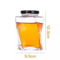 China Vodka Storage Glass Jar with 330ml Capacity and Metal Cover for sale