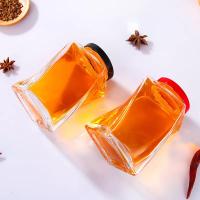 China Vodka Storage Glass Jar with 330ml Capacity and Metal Cover for sale