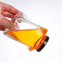 China Vodka Storage Glass Jar with 330ml Capacity and Metal Cover for sale