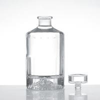 China 150ml Custom Glass Vodka Bottle with Exquisite Embossed and Collar Material Glass for sale