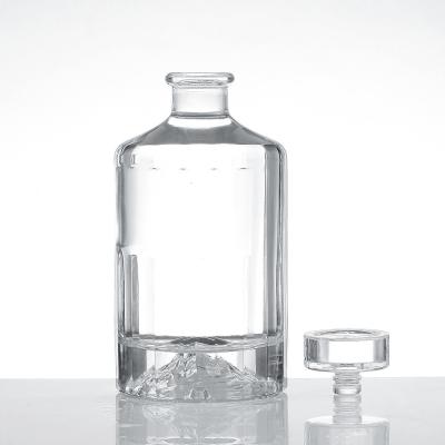 China 150ml Custom Glass Vodka Bottle with Exquisite Embossed and Collar Material Glass for sale