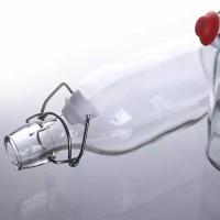 China Round 600ml Glass Bottle With Stopper Caps Carafe Swing Top Beer Bottle Kombucha Bottle Beverage for sale