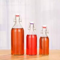 China Round 600ml Glass Bottle With Stopper Caps Carafe Swing Top Beer Bottle Kombucha Bottle Beverage for sale