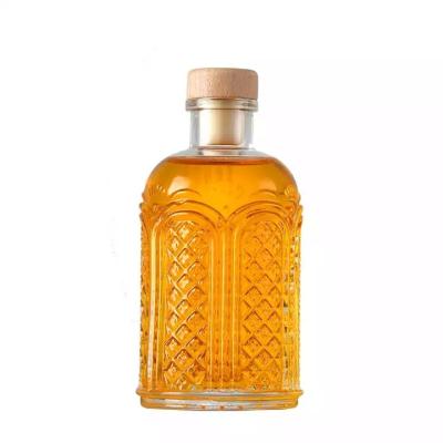 China 280ml Cosmestic Whisky Bottle with Stripe and Embossing in Transparent Triangle Shape for sale