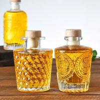 China 280ml Cosmestic Whisky Bottle with Stripe and Embossing in Transparent Triangle Shape for sale