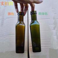 China Glass Base Material 750ml Round Dark Green Camellia Walnut Oil Bottle with Cork Sealing Type for sale
