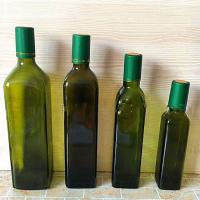 China Glass Base Material 750ml Round Dark Green Camellia Walnut Oil Bottle with Cork Sealing Type for sale